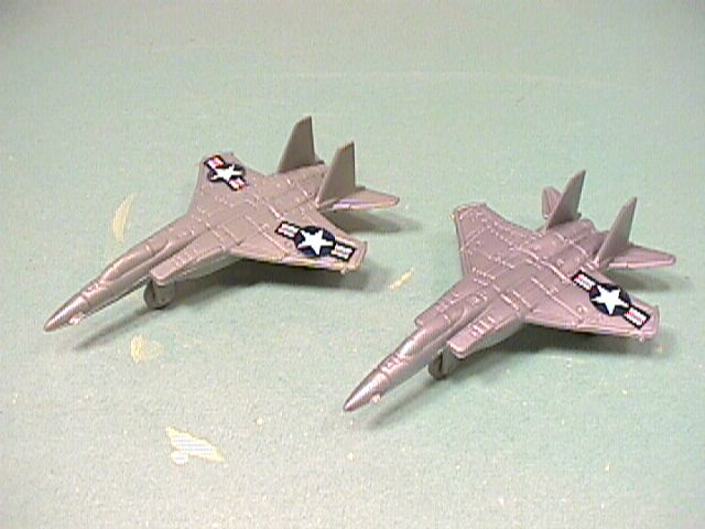 Pair Of Small Modern Black Plastic Jet Fighters