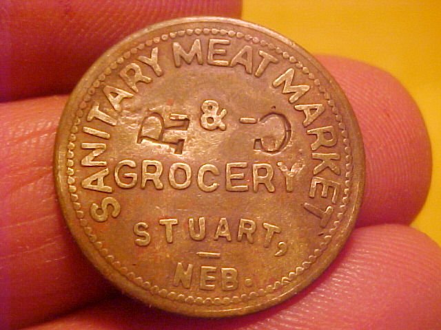 Stuart, Nebraska Token: SANITARY MEAT MARKET & GROCERY 10¢ 1910 - 1913