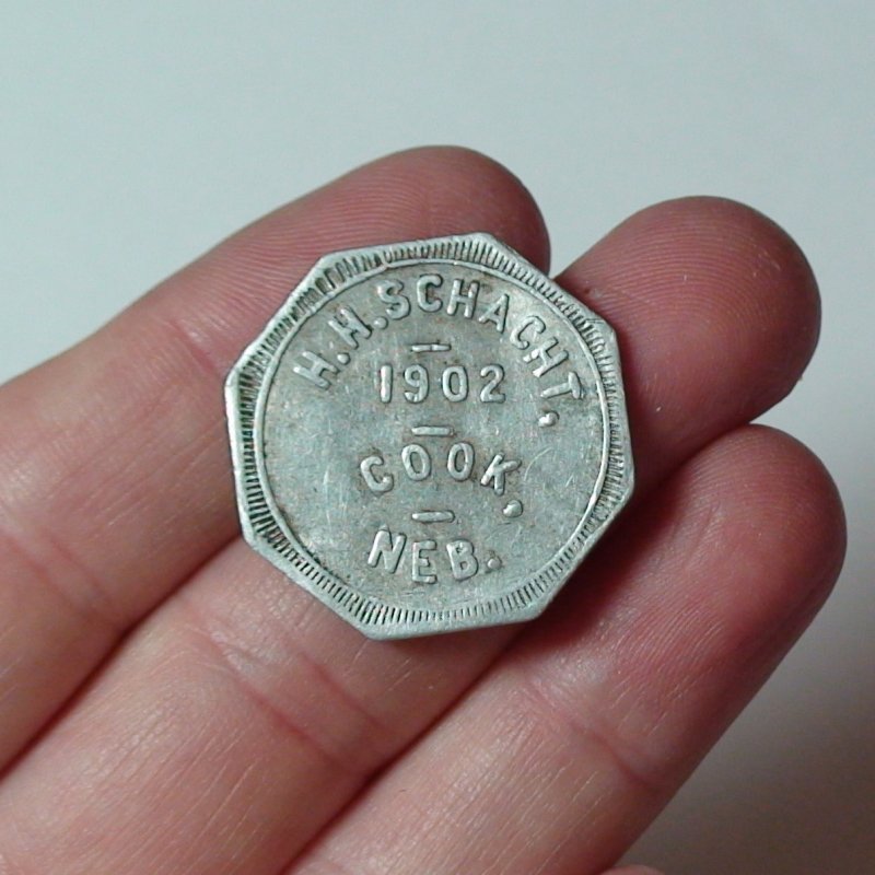 Cook, Nebraska Token: H. H. SCHACHT 1902 general store 25¢